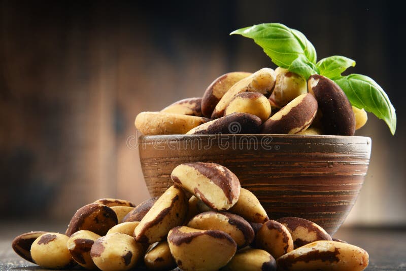 Bowl with Brazil Nuts on Wooden Table Stock Photo - Image of balanced ...