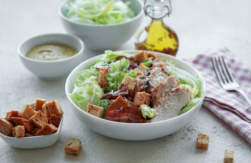 A bowl of Caesar salad stock image. Image of caesar - 335016417