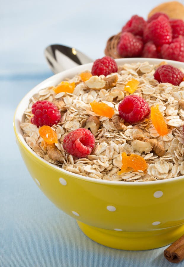 A Bowl Full Of Muesli Cereals With Spoon Stock Image - Image of flakes ...