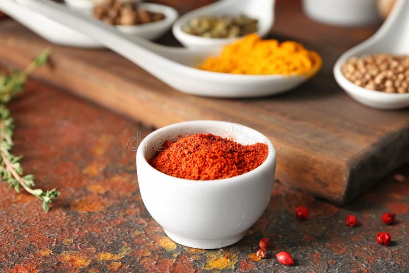 Bowl with Chili Pepper Powder on Color Table Stock Photo - Image of ...