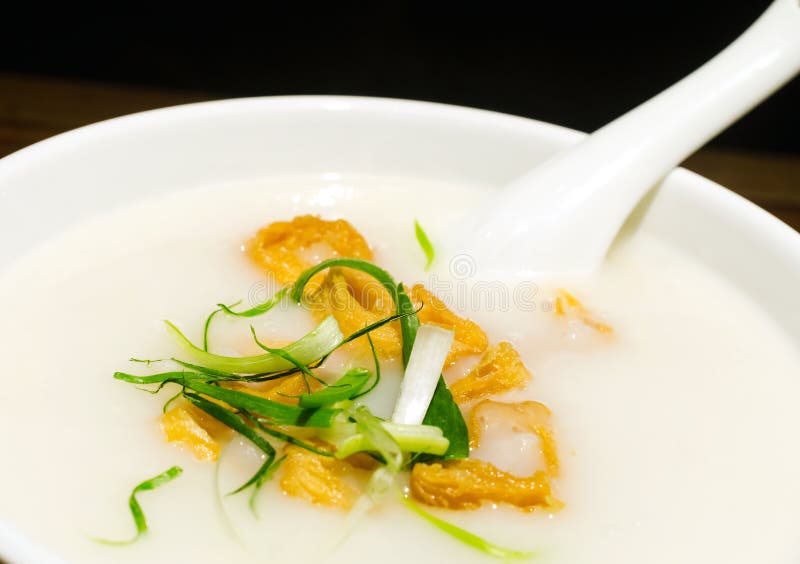 Bowl of Chinese congee stock photo. Image of crackers - 59931584