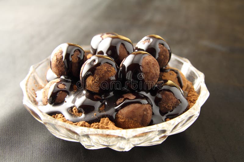 Bowl with chocolate balls stock image. Image of black - 29415539