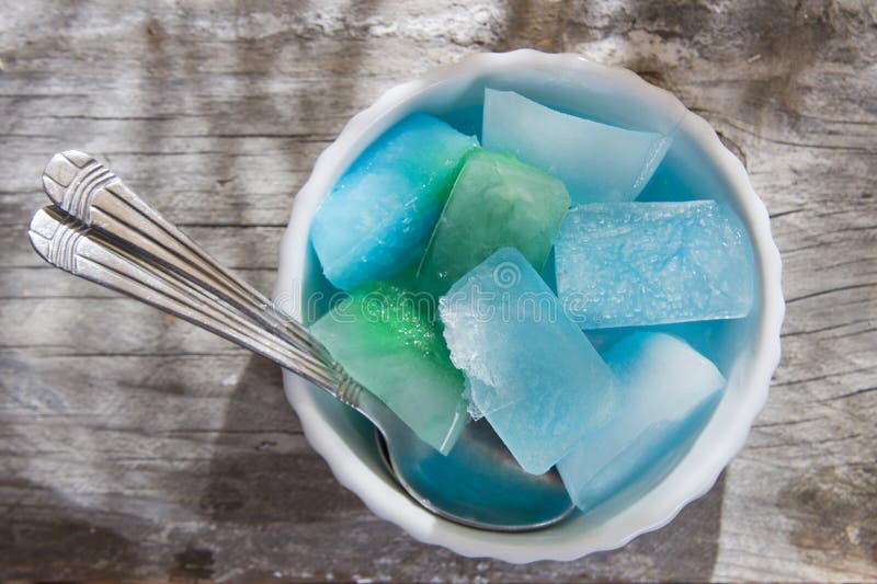 Bowl of colored ice-cubes stock photo. Image of refreshing - 42259648