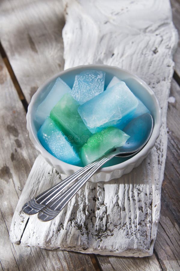 Bowl of colored ice-cubes stock photo. Image of refreshing - 42259648