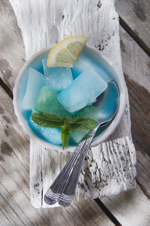Bowl of colored ice-cubes stock photo. Image of refreshing - 42259648
