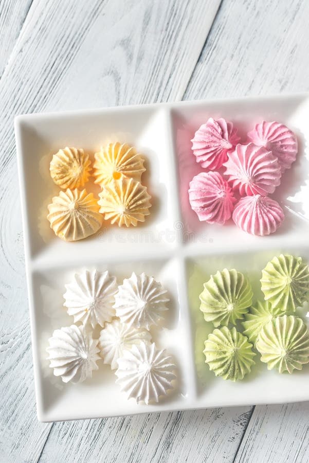 Bowl of colored meringues stock photo. Image of colored - 130174168