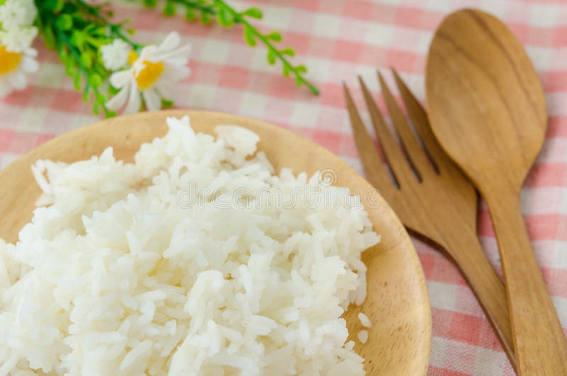 Bowl of Cooked Rice and Wooden Spoon. Stock Image - Image of white ...