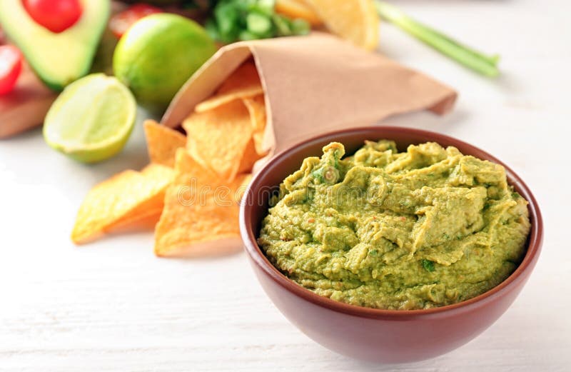 Bowl with Delicious Guacamole on White Table Stock Photo - Image of ...