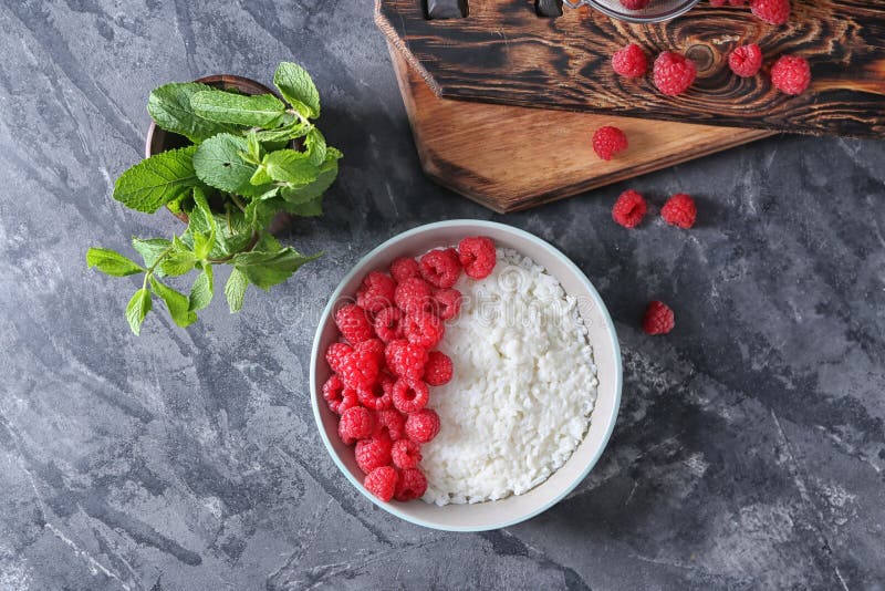 Bowl with Delicious Rice Pudding and Raspberry on Table Stock Photo ...