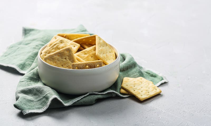 Bowl of Dry Crackers Isolated on Gray Background with Napkin Stock ...