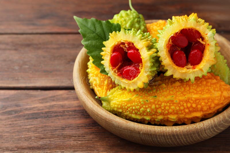 Bowl with Fresh Bitter Melons on Wooden Table, Closeup. Space for Text ...