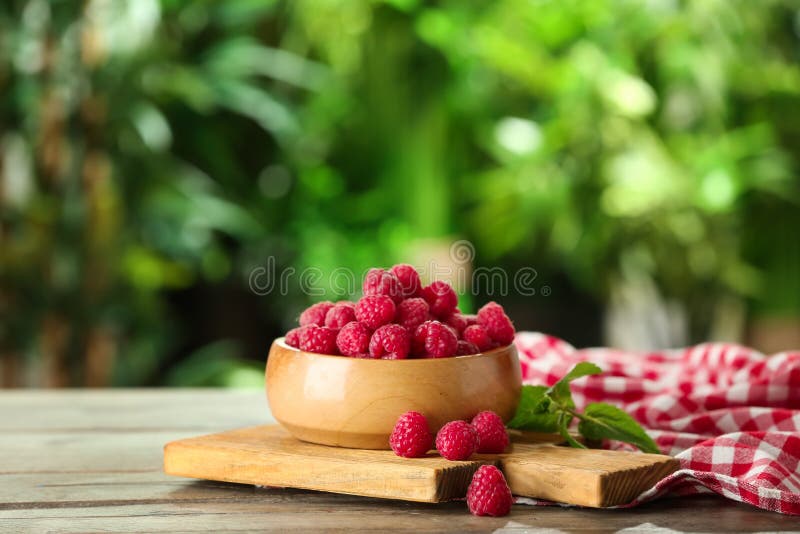 Bowl with Fresh Ripe Raspberries on Table Outdoors Stock Photo - Image ...