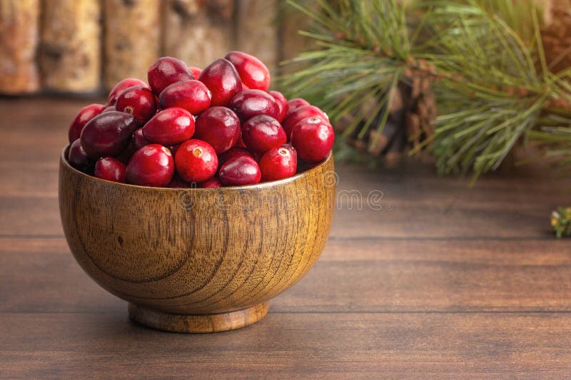 Bowl of Fresh Round Red Cranberries on a Wooden Table Stock Photo ...