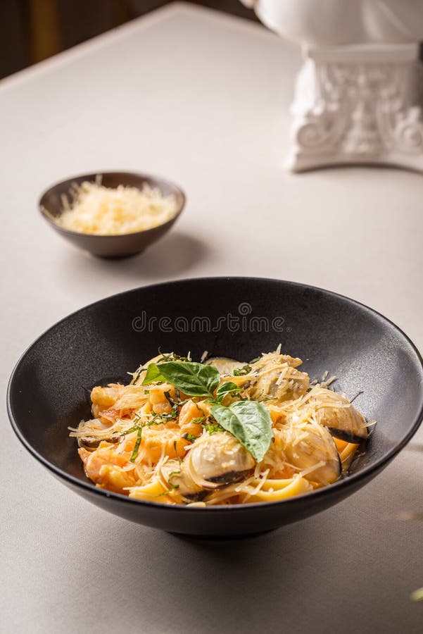Bowl of Freshly-made Delicious Pasta with Seafood on the Table Stock ...