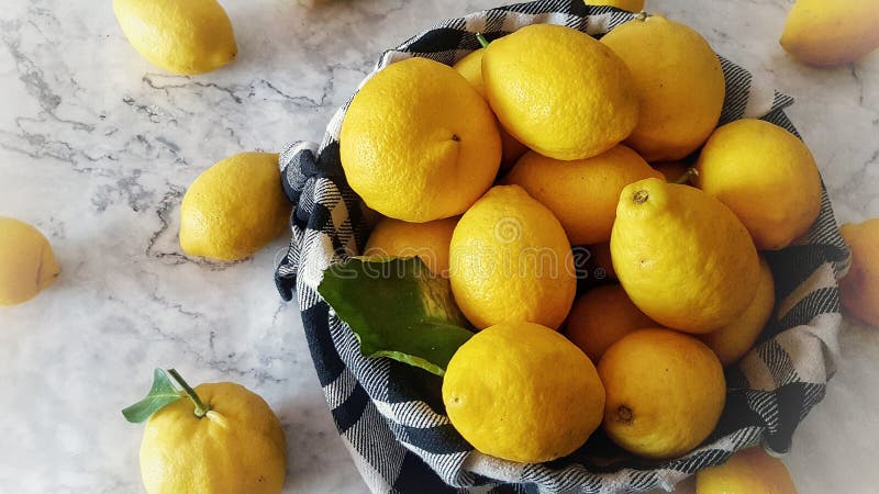 A bowl full of lemons stock photo. Image of kitchen - 275728266