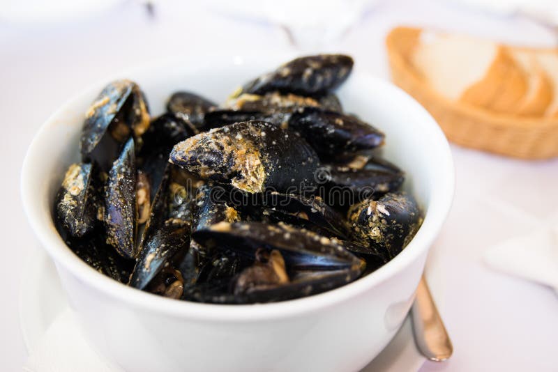 Bowl Full of Mussels with Bread on the Side Stock Photo - Image of ...