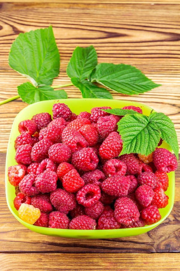 Bowl Full of Ripe Raspberries on Rustic Wooden Table. Stock Photo ...