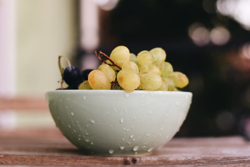 Bowl of Grapes stock image. Image of waterdrops, fruit - 167443047