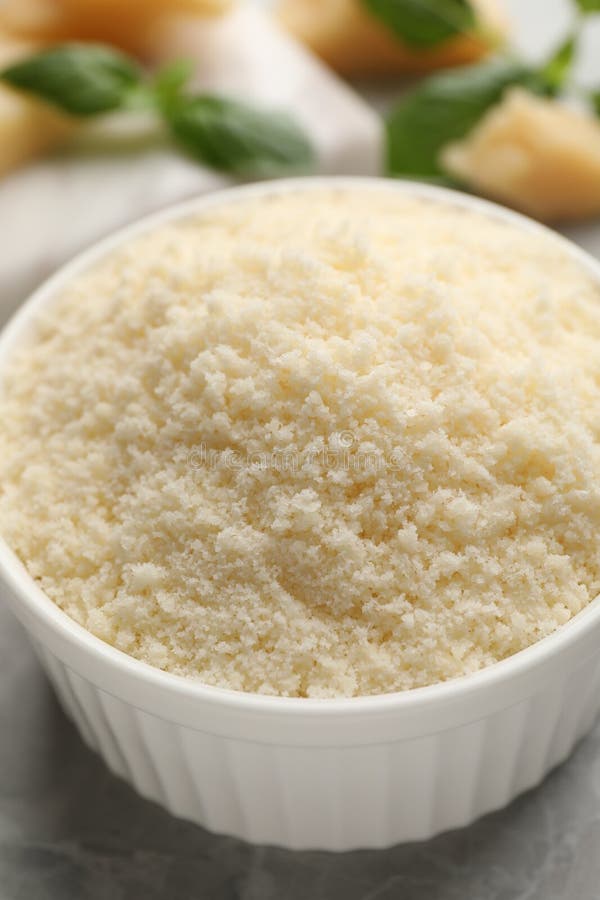 Bowl with Grated Parmesan Cheese on Table, Closeup Stock Photo - Image ...