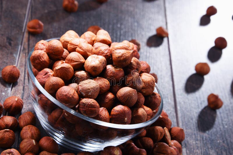 Bowl with Hazelnuts on Wooden Table. Stock Image - Image of delicacies ...