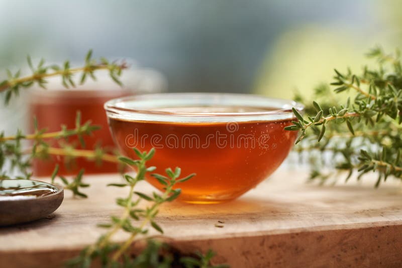 A Bowl of Homemade Thyme Syrup on a Table Stock Photo - Image of ...