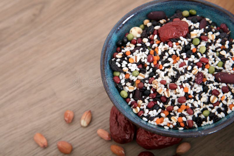 Close Up Eight Treasure Porridge Scooped Out of a Bowl with a Wooden ...