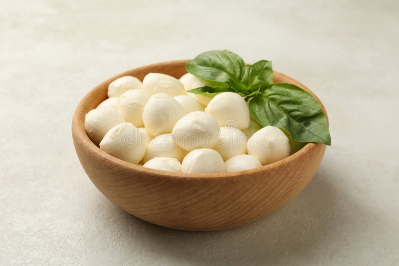 Bowl with Mozzarella and Basil on White Textured Background, Close Up ...