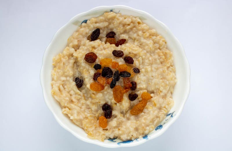 Bowl of Oatmeal with Raisins. Top View, Isolated on White Stock Photo ...