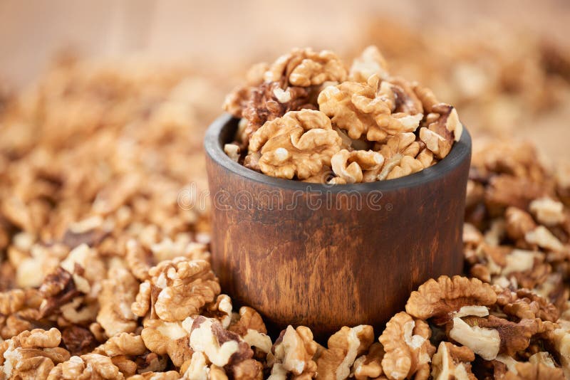 A Bowl and a Pile of Peeled Walnut Kernels. Close-up Stock Photo ...