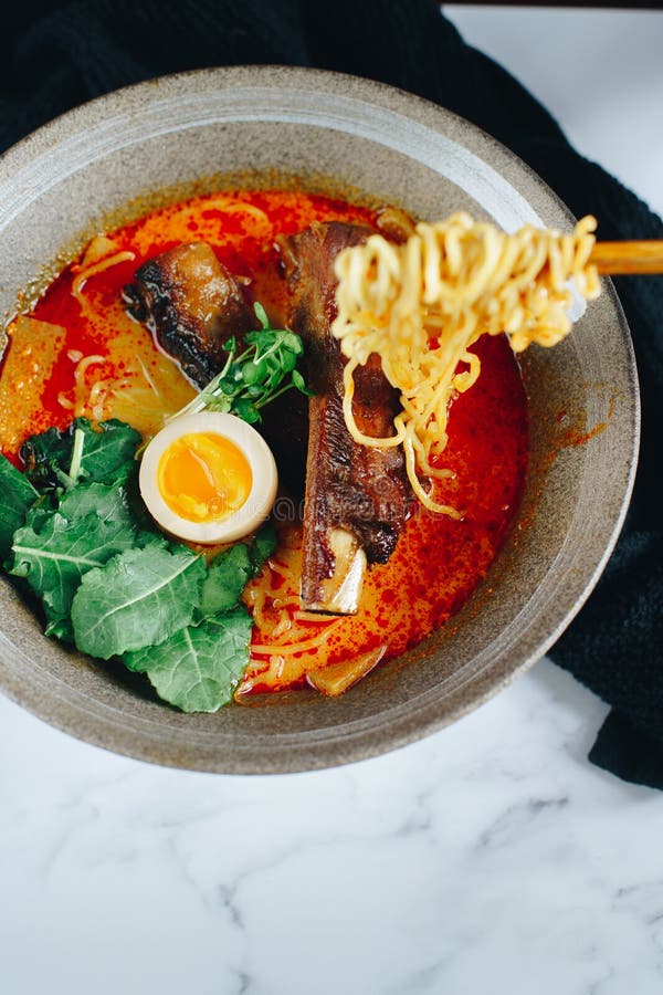 A Bowl of Ramen with a Piece of Egg in it Stock Image - Image of bowl ...