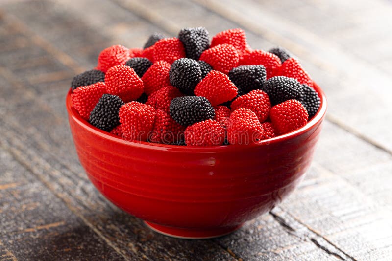 Bowl of Raspberry and Blackberry Gummy Candies on a Rustic Wooden Table ...