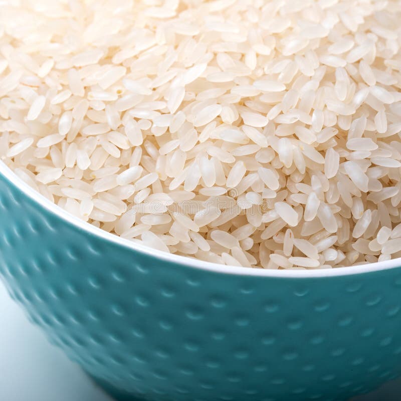 Bowl of Raw Organic Rice on White Background. Blue Bowl Full of Rice on ...