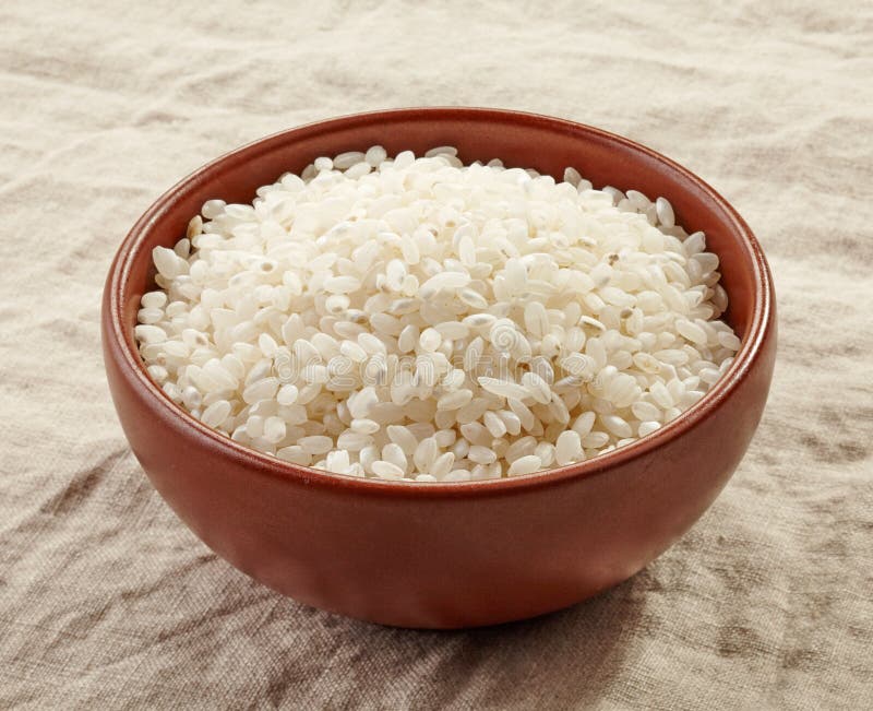 Bowl of raw round rice stock image. Image of dietary - 55787093