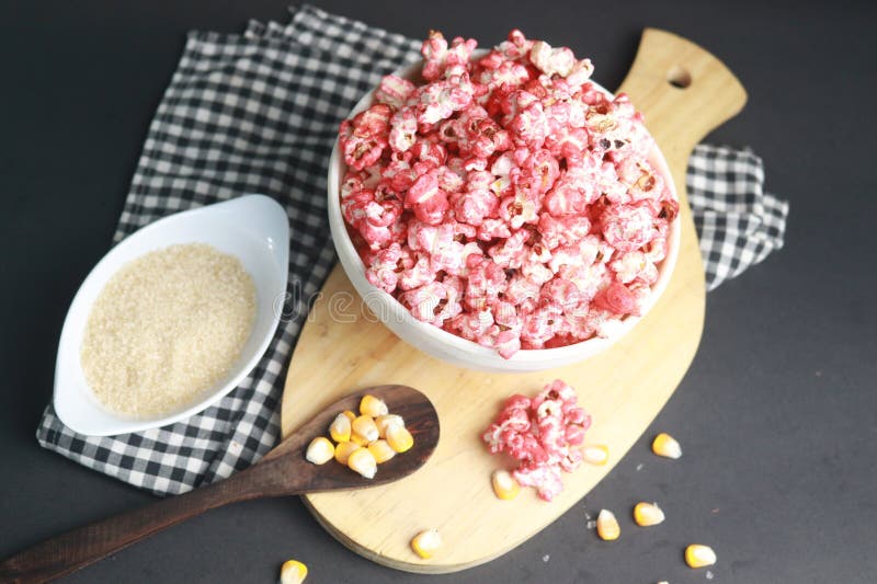 Bowl of Red Flavored Popcorn with Ingredients on a Rustic Cutting Board ...