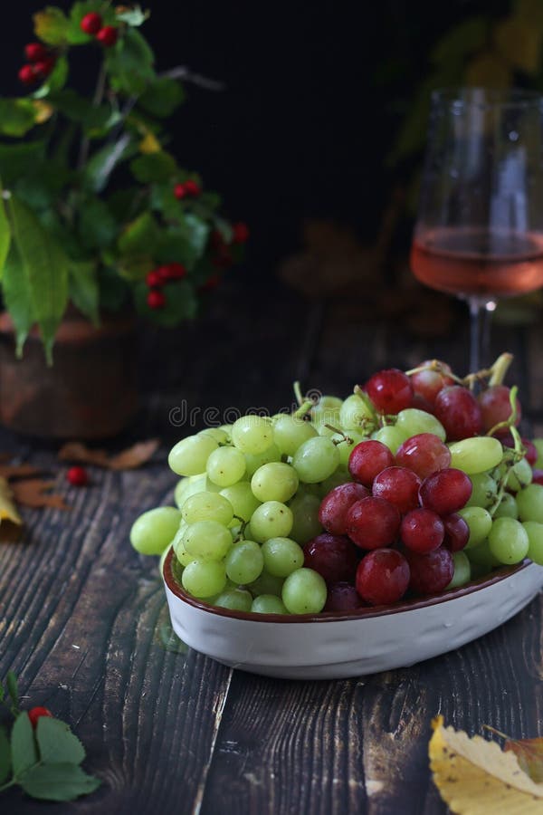 A Bowl with Red and Green Grape in Rustic Style Stock Image - Image of ...