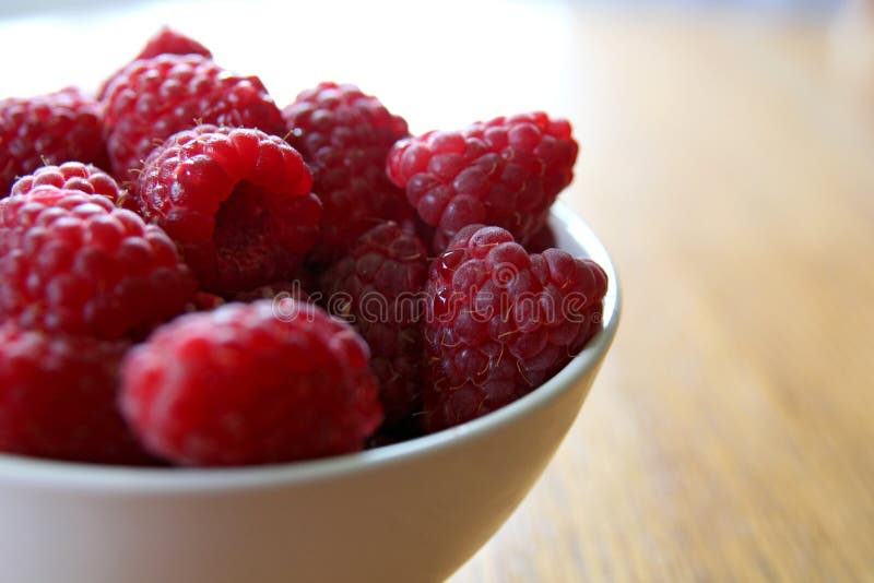 Bowl of Red Raspberries stock photo. Image of berry, green - 10290312