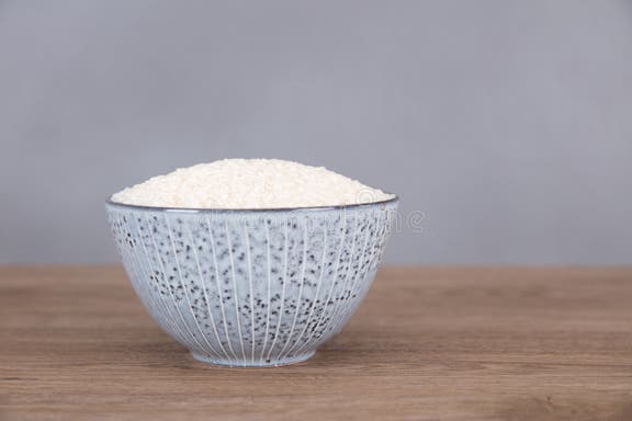 A bowl of rice on table stock image. Image of food, life - 253385813