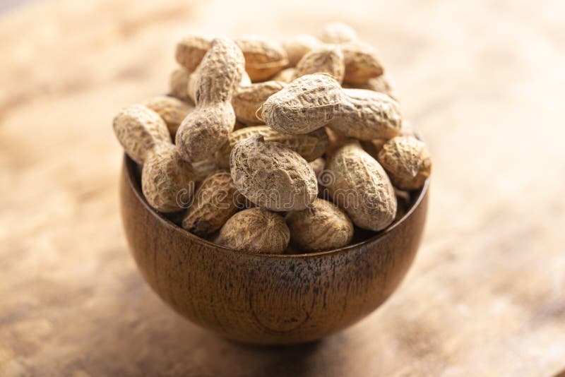 A Bowl of in Shell Peanut on a Wooden Table Stock Photo - Image of ...