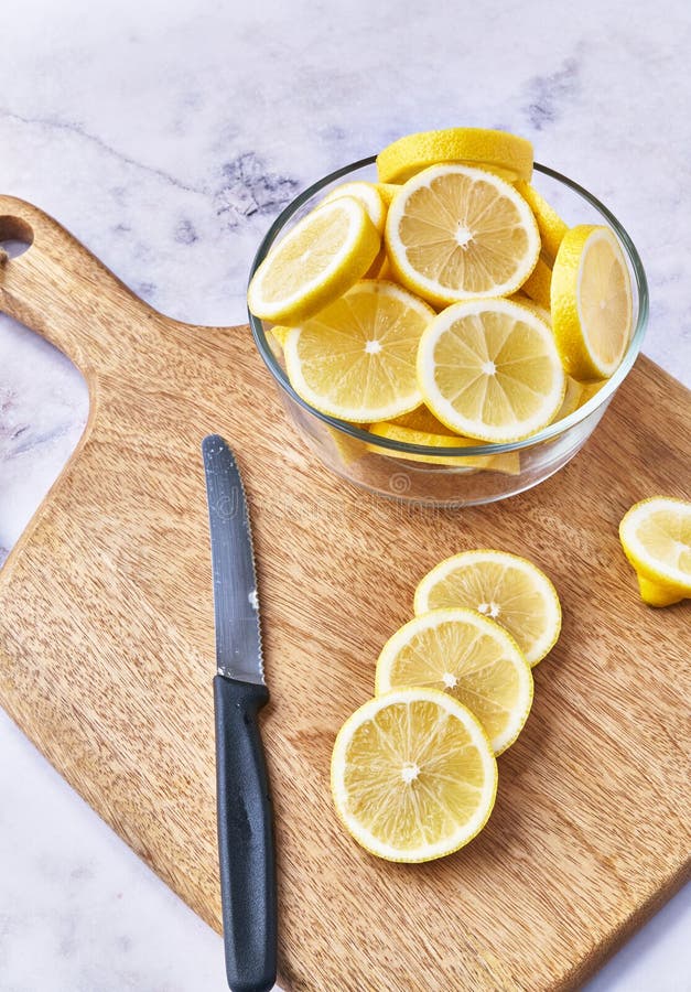 Bowl of Slices of Lemon on a Marble Surface Stock Photo - Image of ...