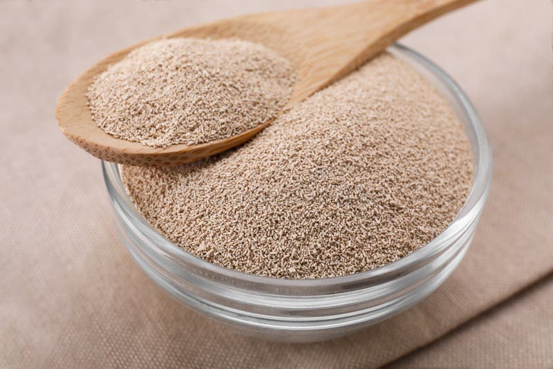 Bowl and Spoon with Active Dry Yeast on Cloth, Closeup Stock Image ...