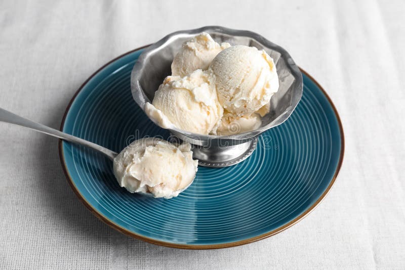 Bowl and Spoon with Tasty Vanilla Ice Cream Stock Photo - Image of ...