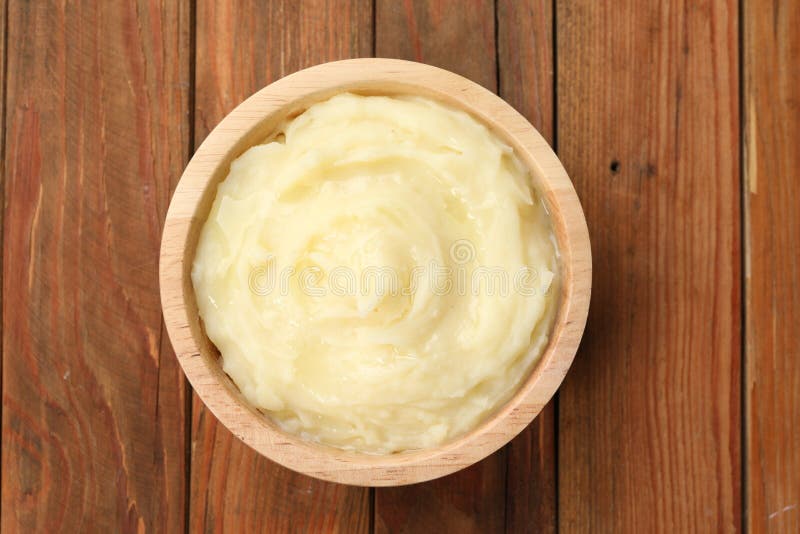 Bowl of Tasty Mashed Potato on Wooden Table, Top View Stock Image ...