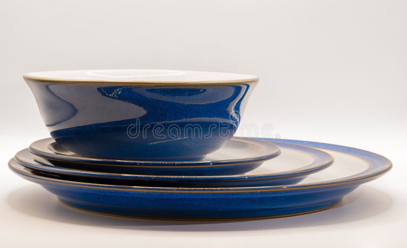 Bowl and Three Crockery Plates of White and Blue Colors Stock Photo ...