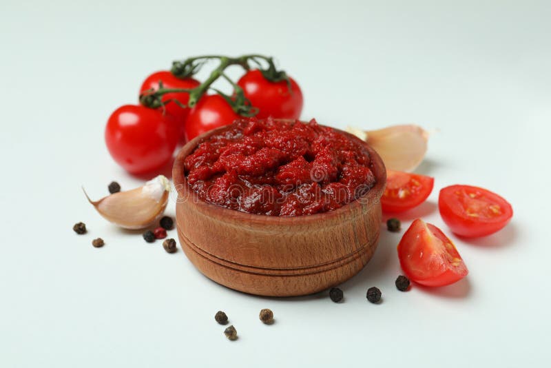 Bowl of Tomato Paste, Tomatoes, Pepper and Garlic on White Background ...