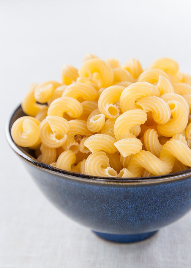Bowl of uncooked macaroni stock photo. Image of meal - 26529202