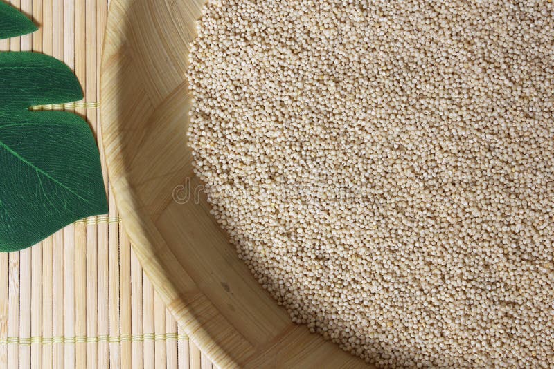 Bowl of Uncooked Millet with Leaf and Bamboo Mat Stock Photo - Image of ...