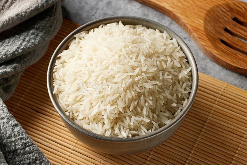 Bowl of uncooked rice stock photo. Image of crop, cereal - 346366260