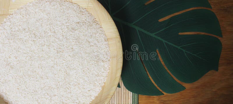 Bowl of Uncooked White Rice with Leaf and Bamboo Mat Stock Image ...