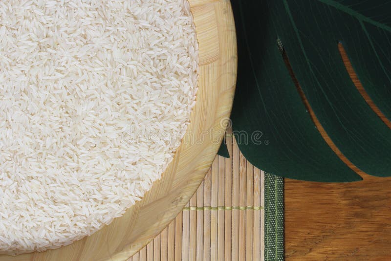 Bowl of Uncooked White Rice with Leaf and Bamboo Mat Stock Image ...