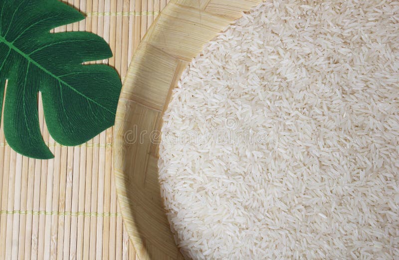 Bowl of Uncooked White Rice with Leaf and Bamboo Mat Stock Image ...